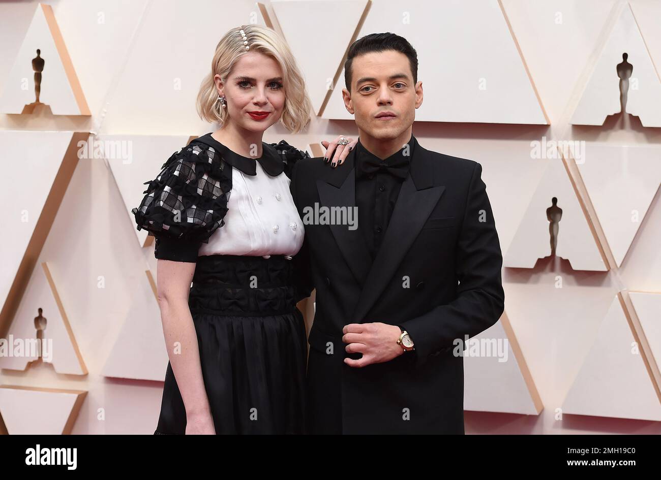 Lucy Boynton, left, and Rami Malek arrive at the Oscars on Sunday, Feb ...