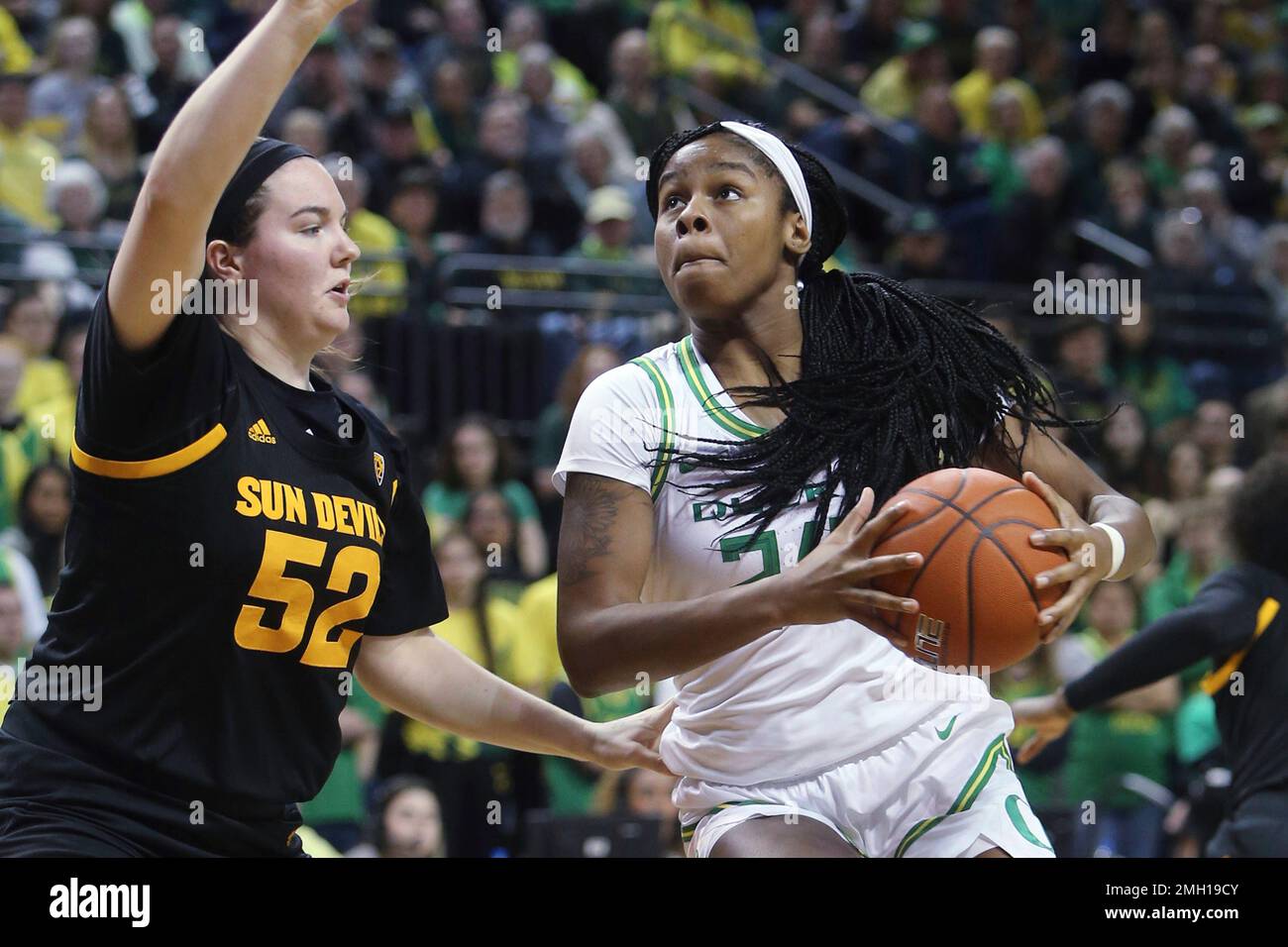 Oregon's Ruthy Hebard, right, goes up for a shot against Arizona State ...