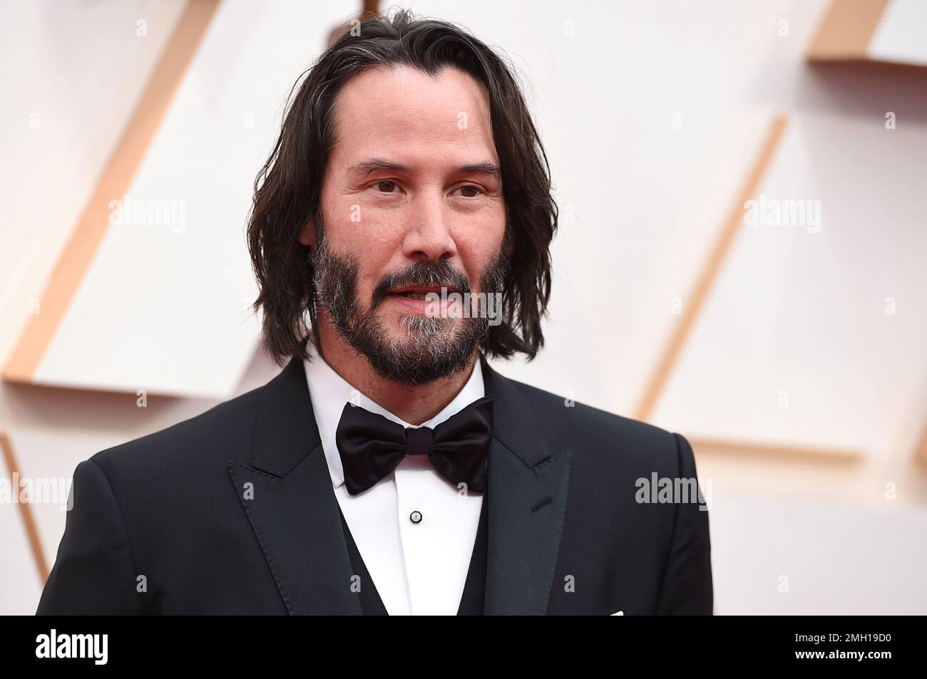 Keanu Reeves arrives at the Oscars on Sunday, Feb. 9, 2020, at the ...