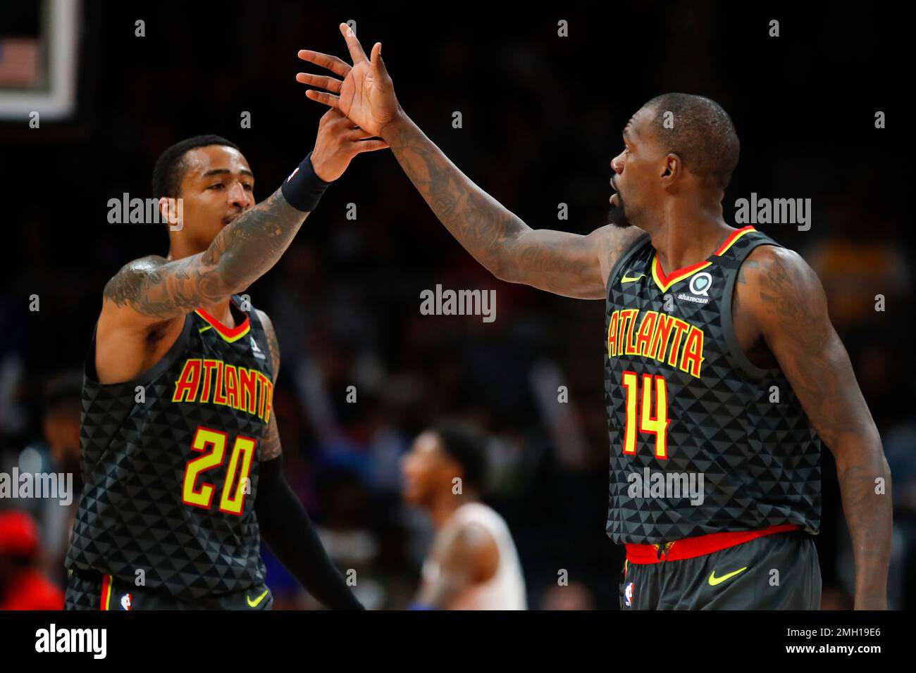 Atlanta Hawks forward John Collins (20) reacts with center Dewayne ...