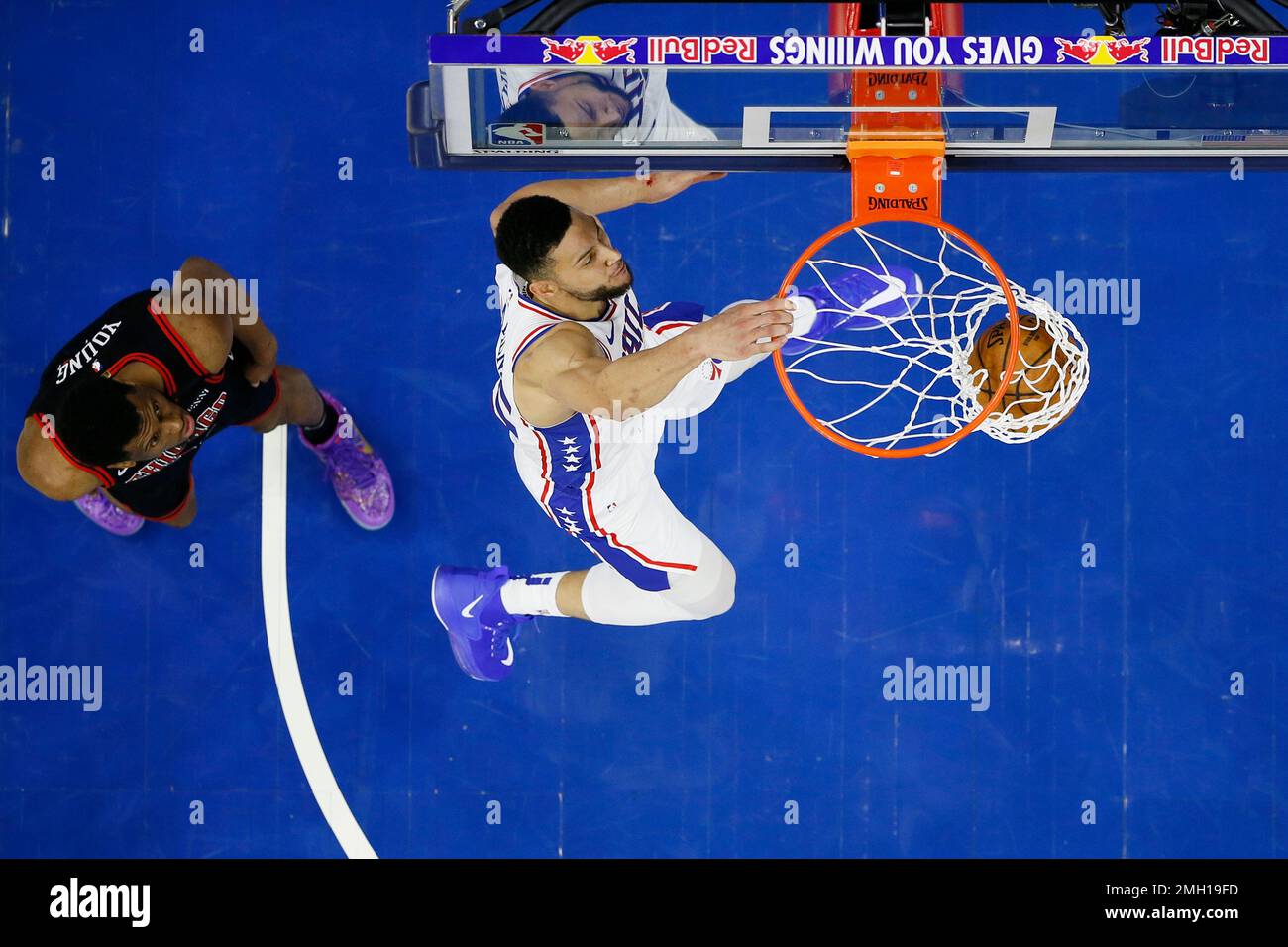 Philadelphia 76ers' Ben Simmons, right, dunks past Chicago Bulls' Thaddeus Young during the ...