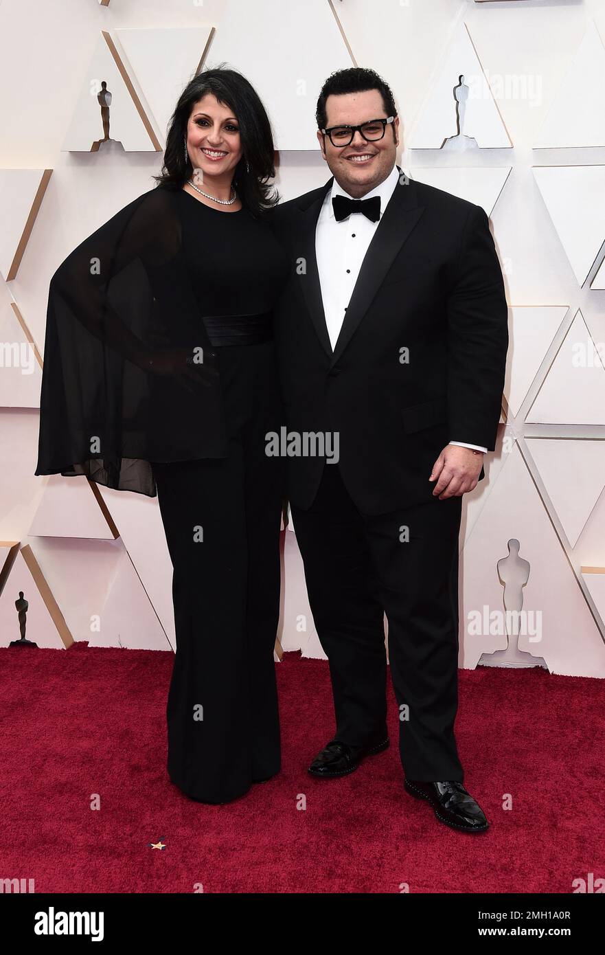 Ida Darvish, left, and Josh Gad arrive at the Oscars on Sunday, Feb. 9 ...
