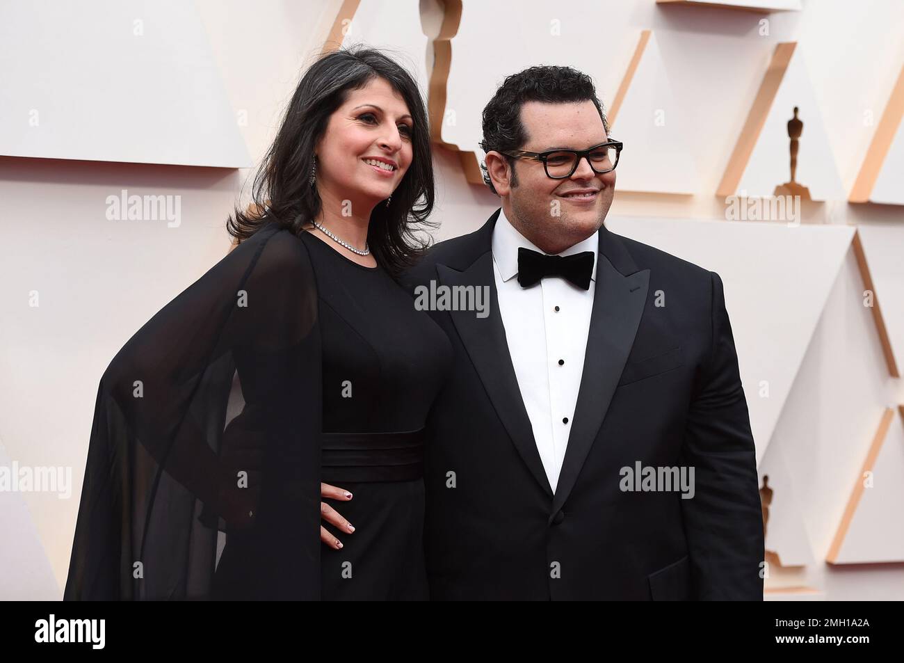 Ida Darvish, left, and Josh Gad arrive at the Oscars on Sunday, Feb. 9 ...