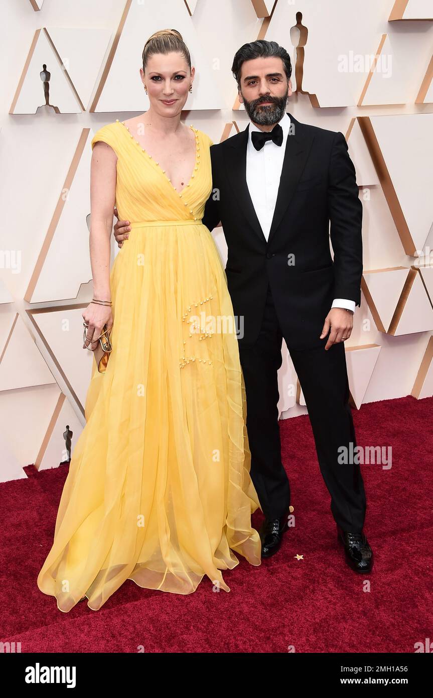 Elvira Lind, left, and Oscar Issac arrive at the Oscars on Sunday, Feb ...