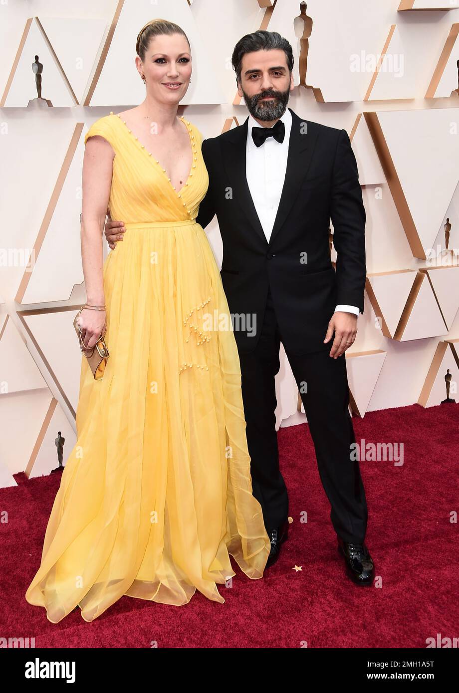 Elvira Lind, left, and Oscar Issac arrives at the Oscars on Sunday, Feb ...
