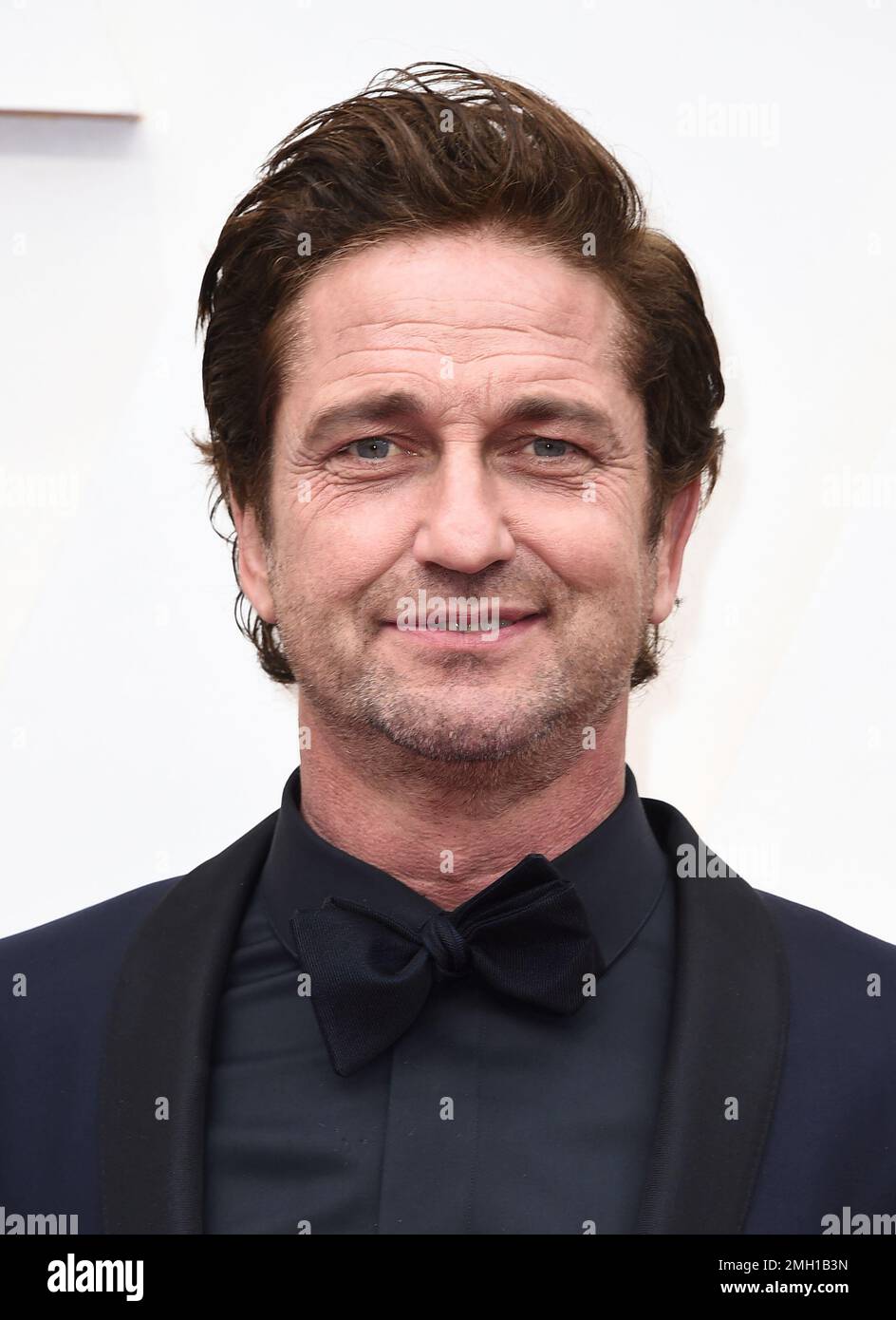Gerard Butler arrives at the Oscars on Sunday, Feb. 9, 2020, at the ...