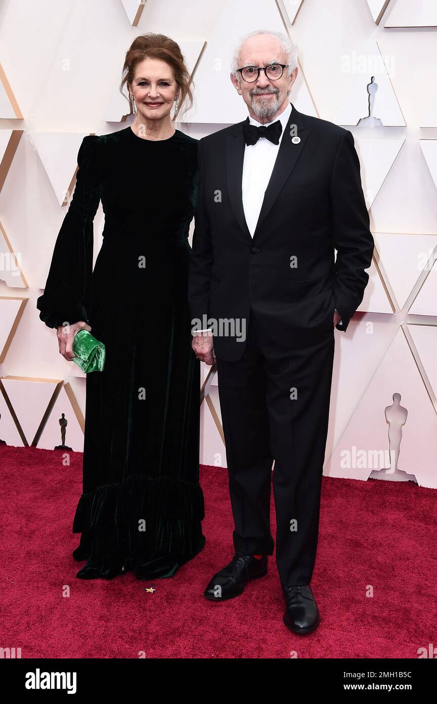 Kate Fahy, left, and Jonathan Pryce arrive at the Oscars on Sunday, Feb ...