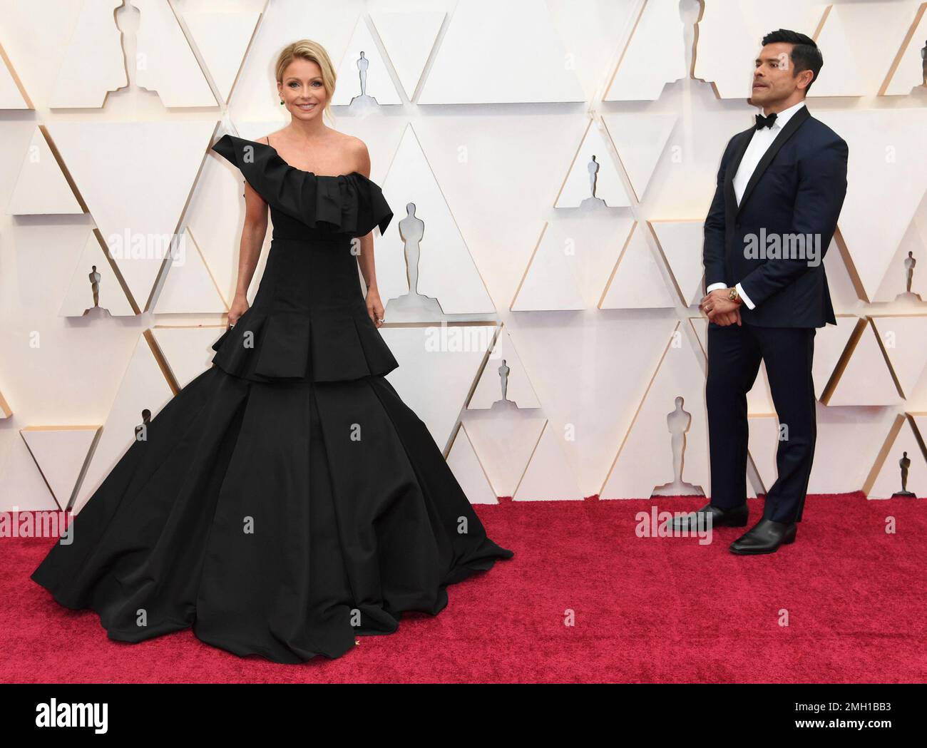 Kelly Ripa, left, and Mark Consuelos arrive at the Oscars on Sunday ...