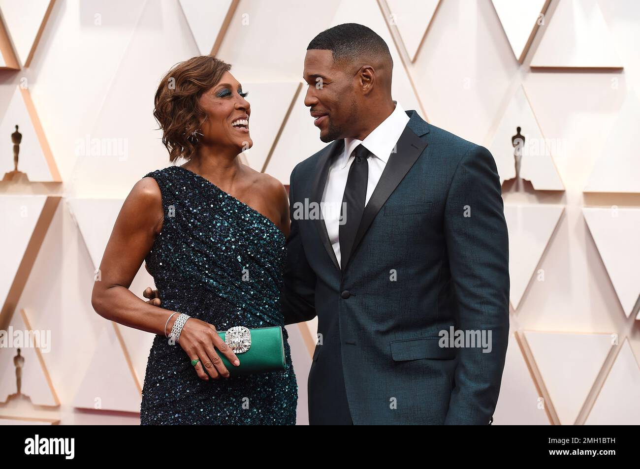 Robin Roberts, left, and Michael Strahan arrive at the Oscars on Sunday ...
