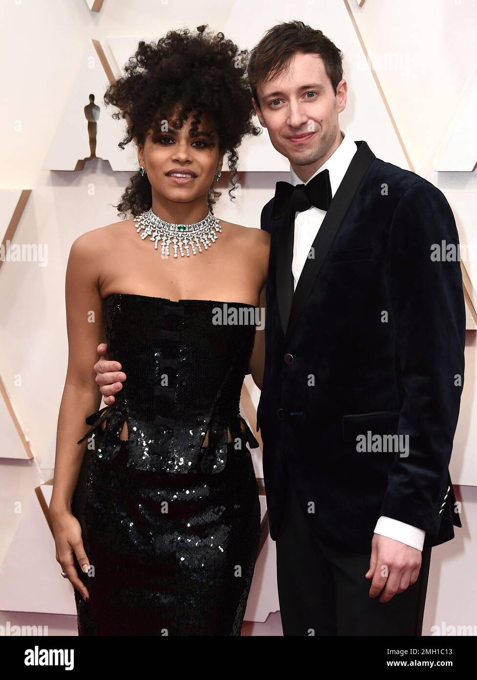 Zazie Beetz, left, and David Rysdahl arrive at the Oscars on Sunday ...