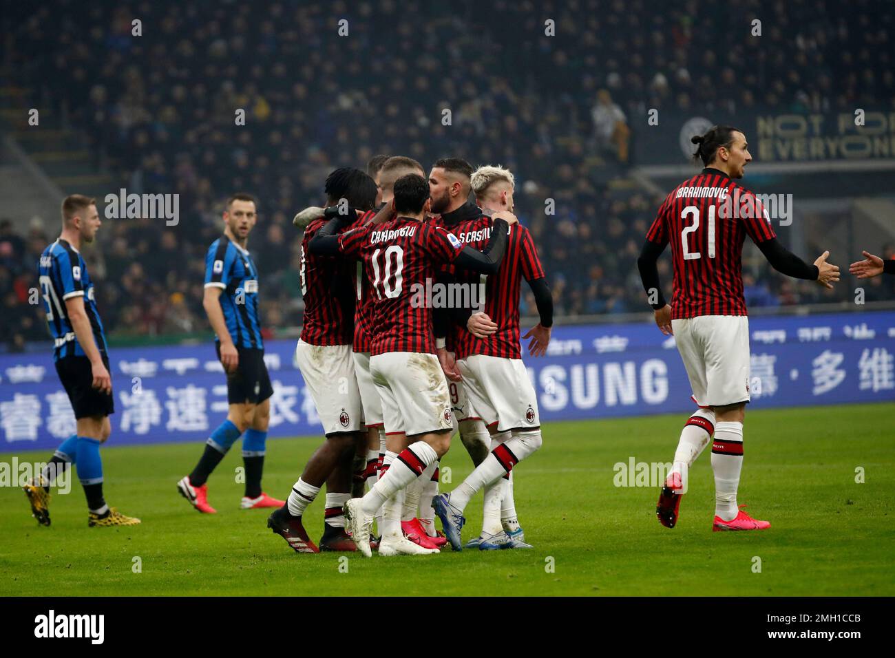 AC Milan's players celebrate their side's opening goal during the Serie ...