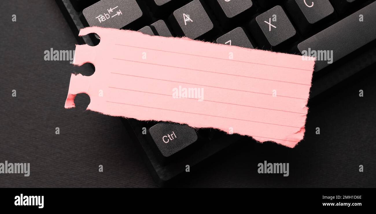 Colored sticker lying on black keyboard. Important information written ...