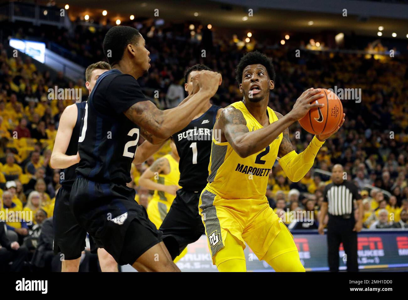 Marquette's Sacar Anim (2) drives to the basket against Butler's Henry ...