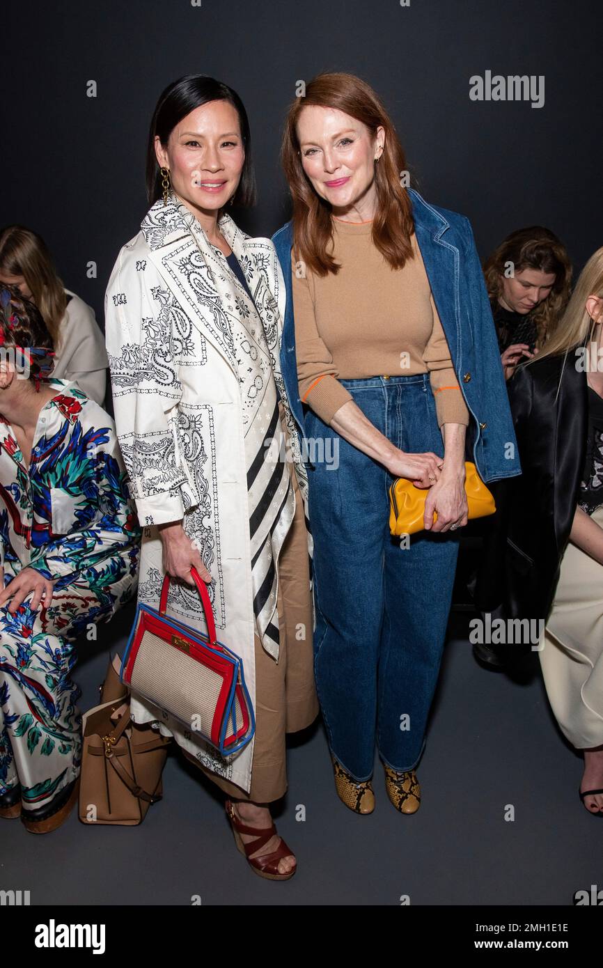 Lucy Liu, left, and Julianne Moore attend the Tory Burch fashion show ...