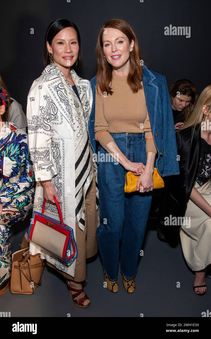Lucy Liu, left, and Julianne Moore attend the Tory Burch fashion show ...