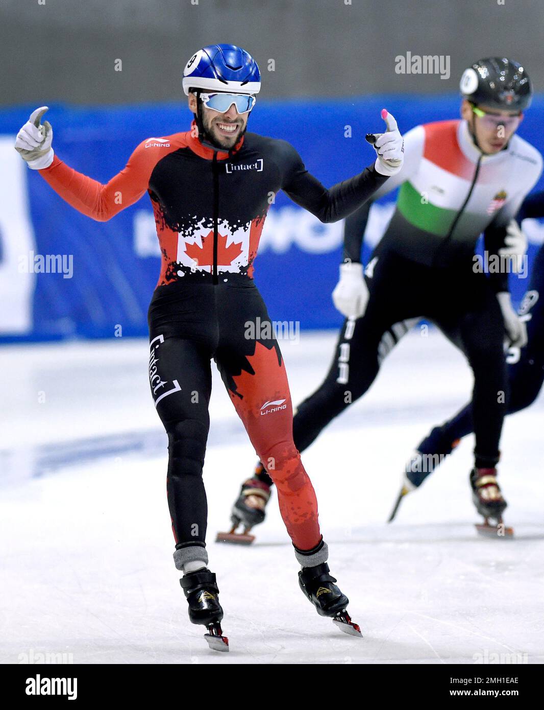 Canada's Steven Dubois celebrates as he crosses the finish line of the ...