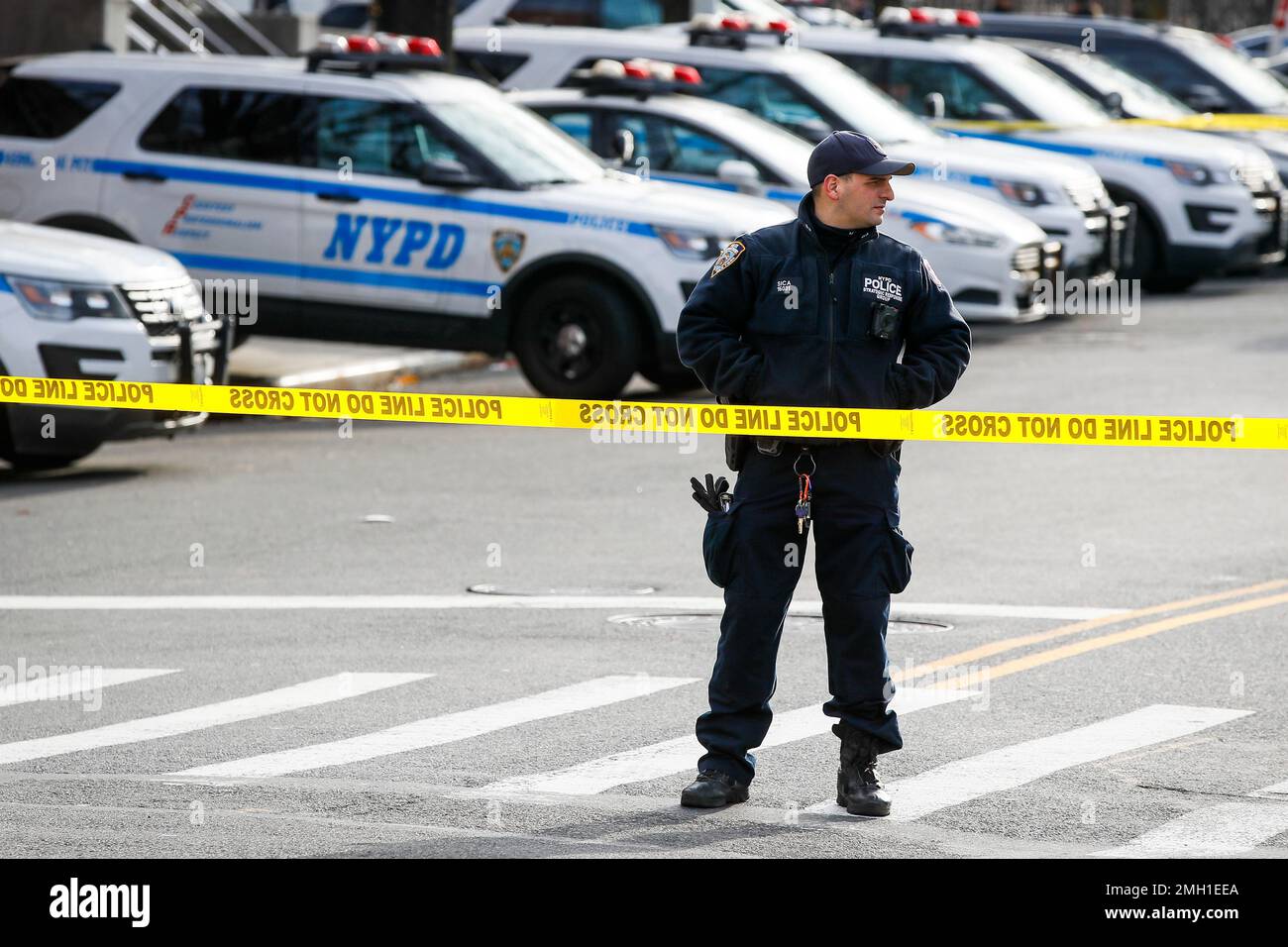 New York police set up a perimeter outside the 41st police precinct at ...
