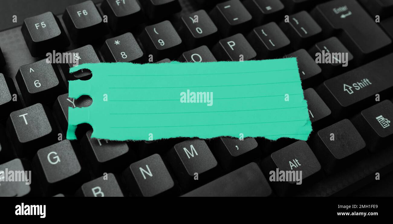 Colored sticker lying on black keyboard. Important information written ...