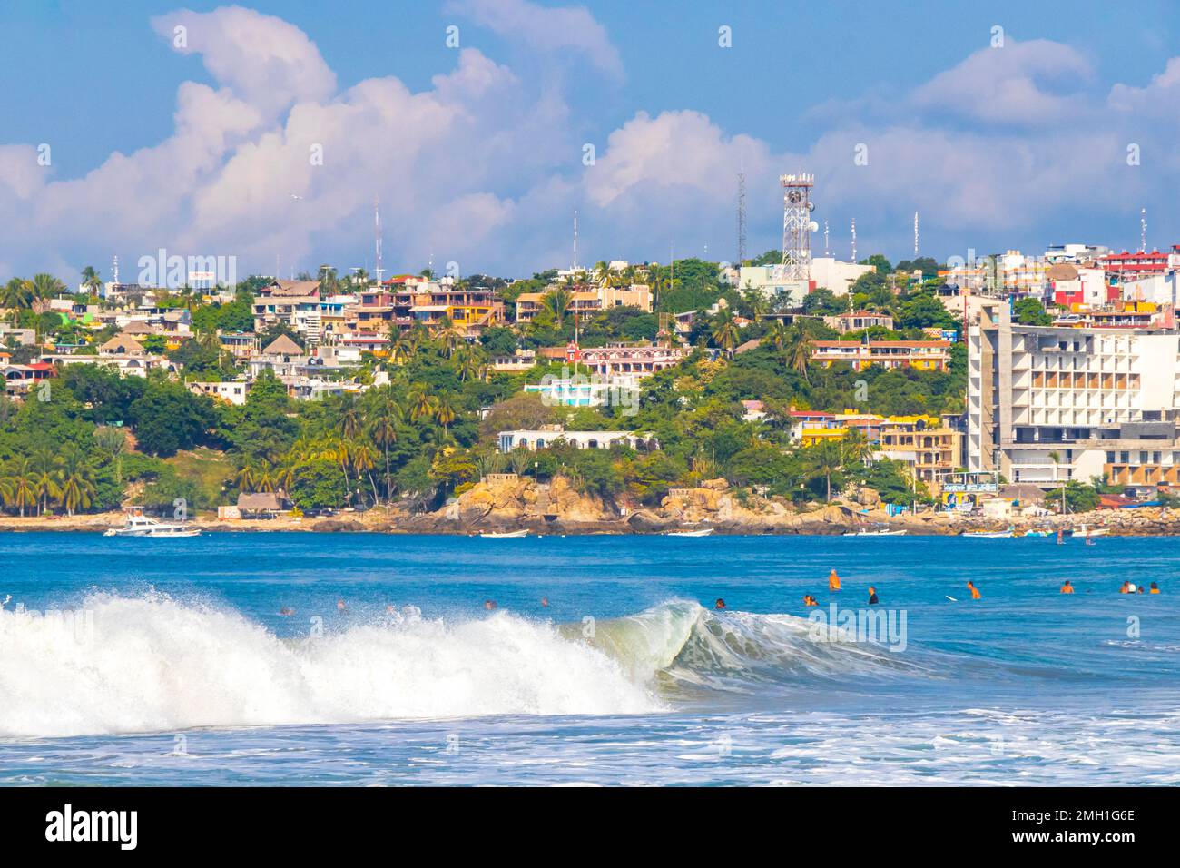 Surfer surfing on surfboard on high waves in Zicatela Puerto Escondido ...
