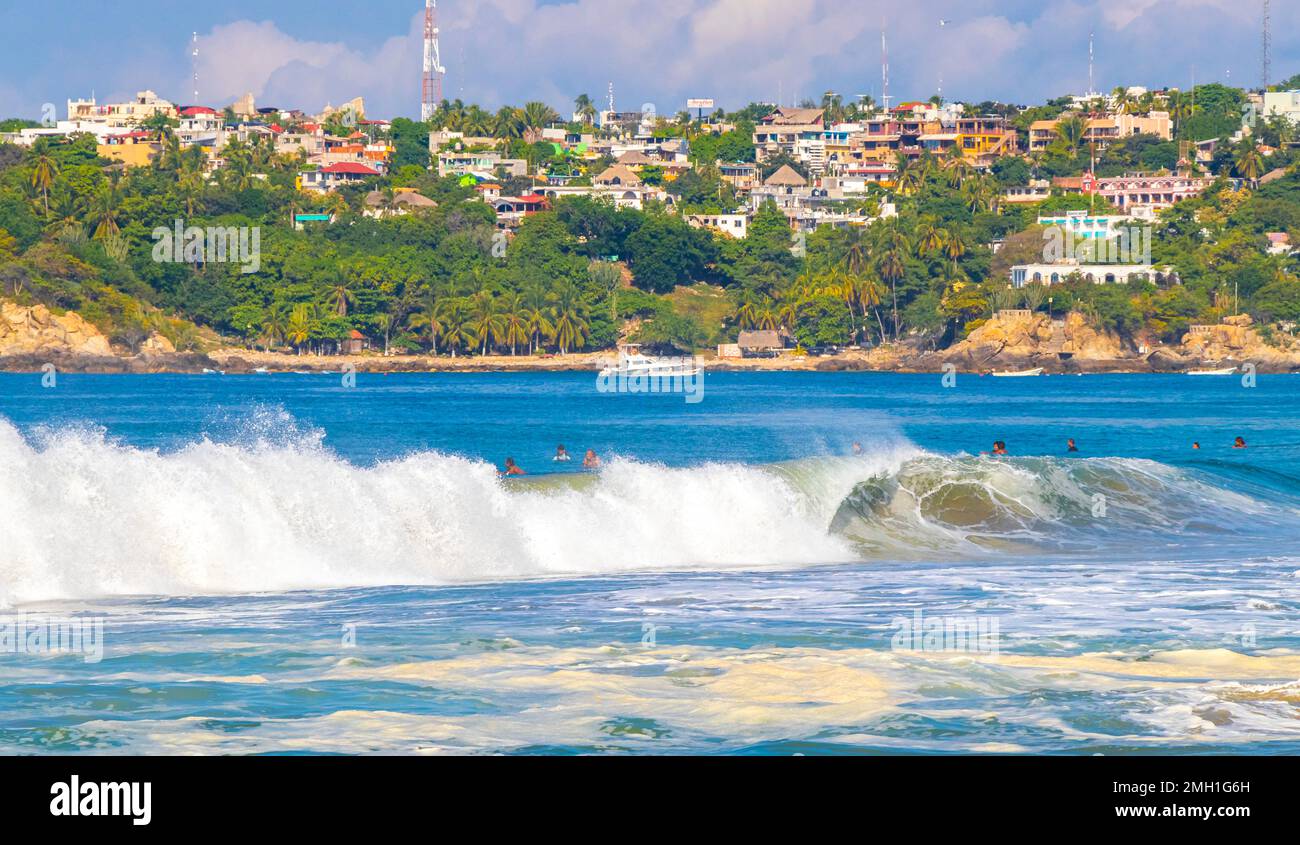 Surfer surfing on surfboard on high waves in Zicatela Puerto Escondido ...