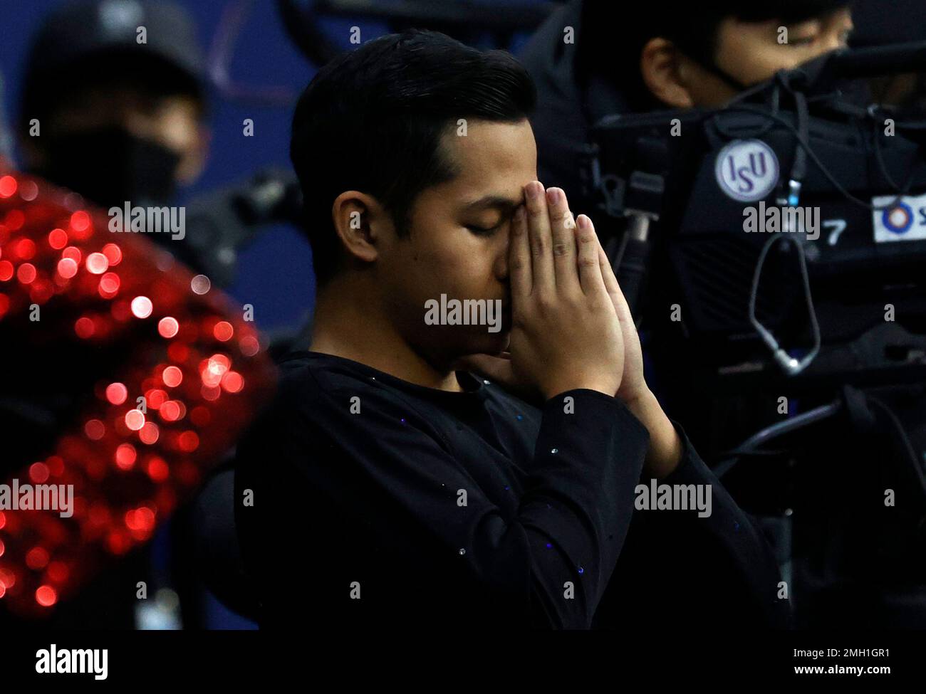 Philippines' Christopher Caluza reacts before the men's single free ...