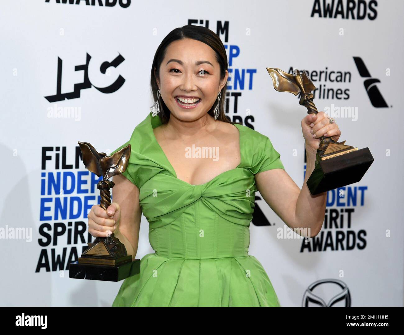 Lulu Wang poses in the press room with her award for best feature for ...