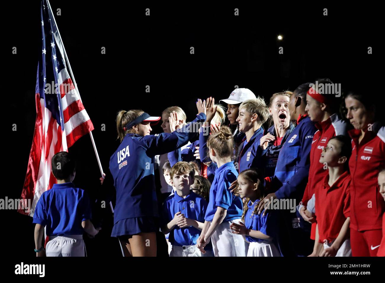 United States' Sofia Kenin, left, greets teammates during introductions ...