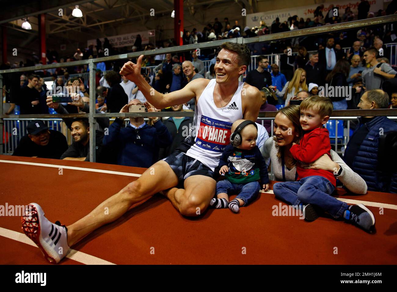 Chris O'Hare, of Britain, poses for photographers with his family after ...