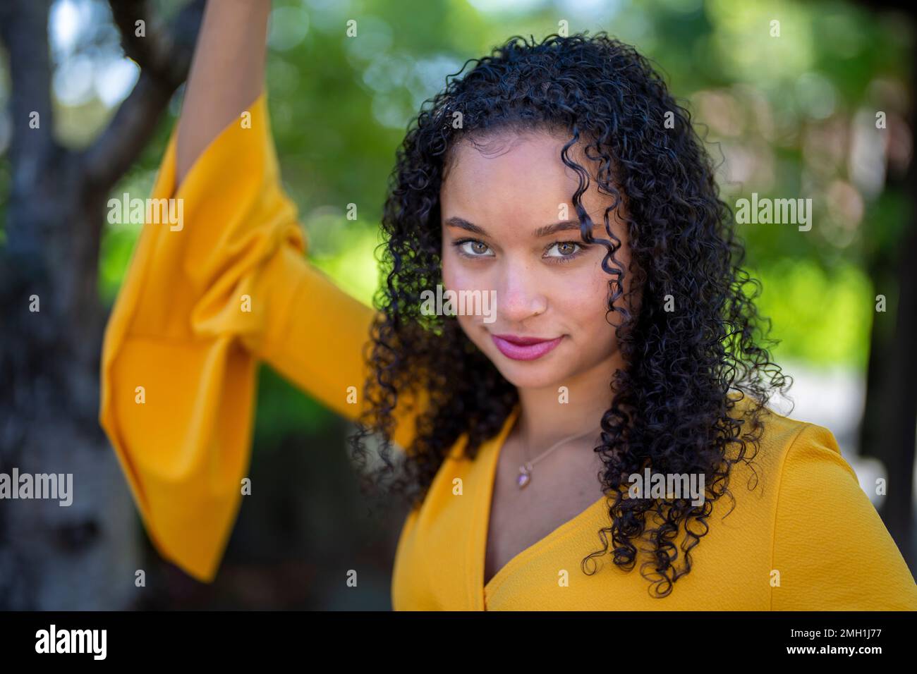 Close up of Beautiful Young African American Woman Standing with Arms ...