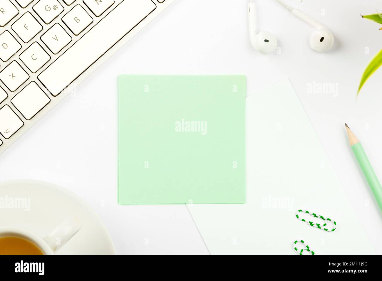 Notebook and Colored Papers Stickers Lying On White Desk. Multiple ...