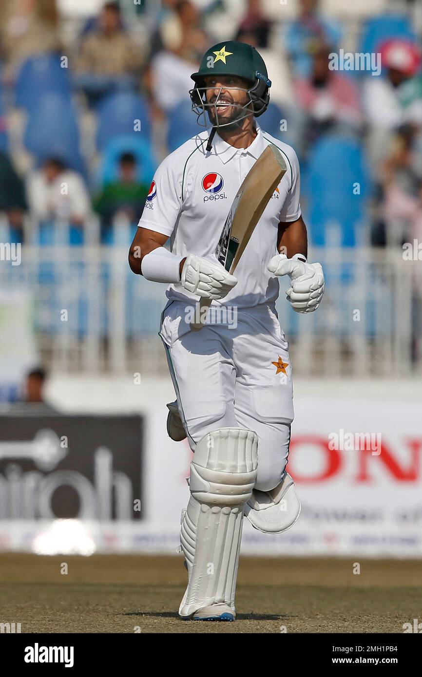 Pakistani batsman Shan Masood reacts after completing his century ...