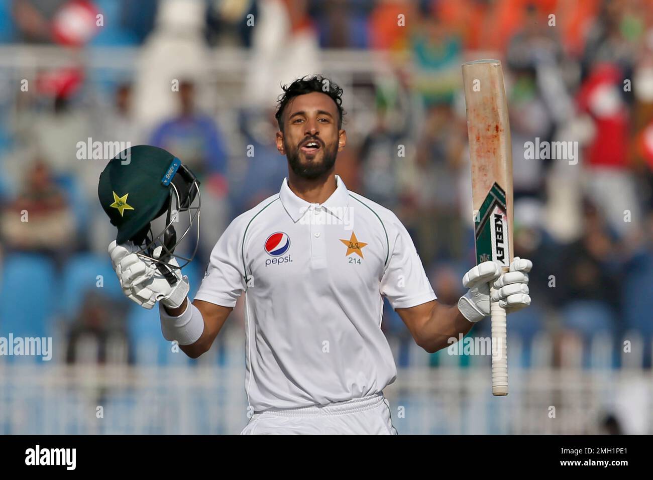 Pakistani batsman Shan Masood celebrates after completing his century ...