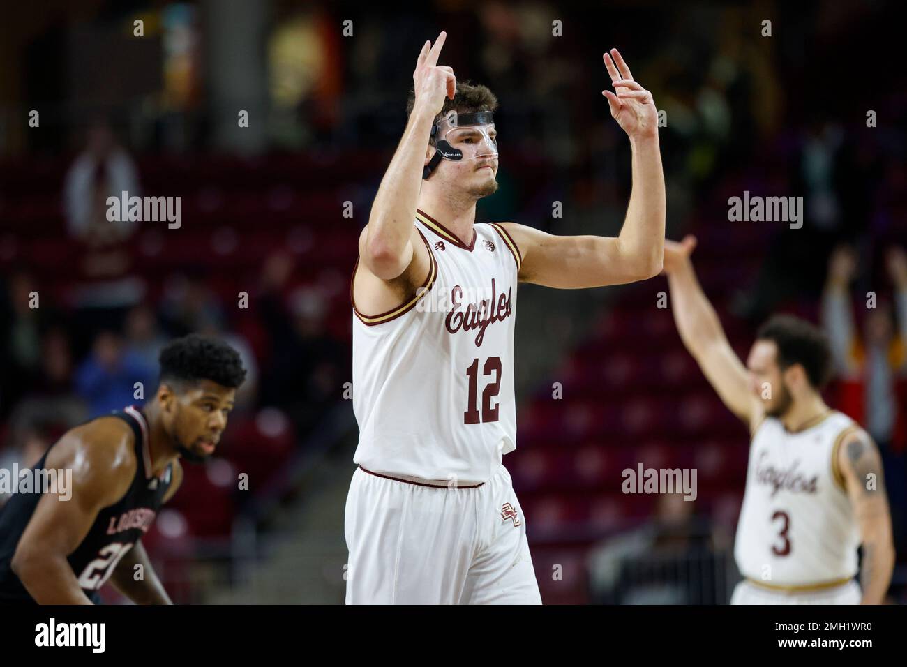 Boston College forward Quinten Post (12) reacts after making a three ...