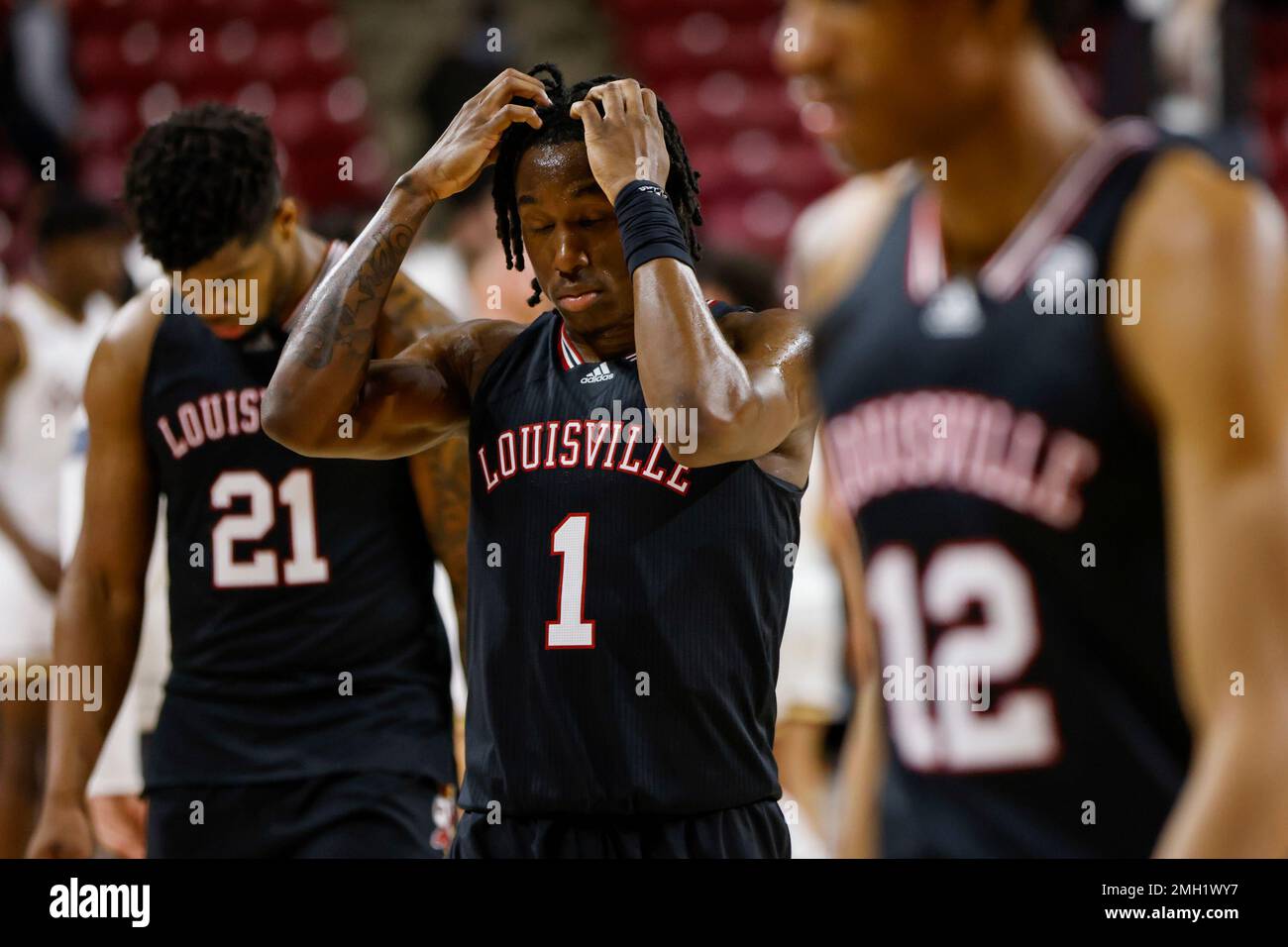 Louisville forward Mike James (1) reacts to the team's loss to Boston ...