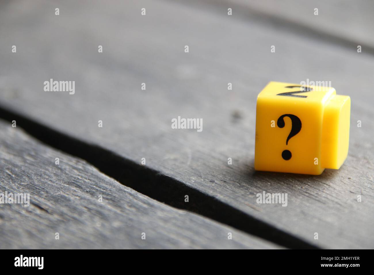 Large question mark on a wooden background Stock Photo - Alamy