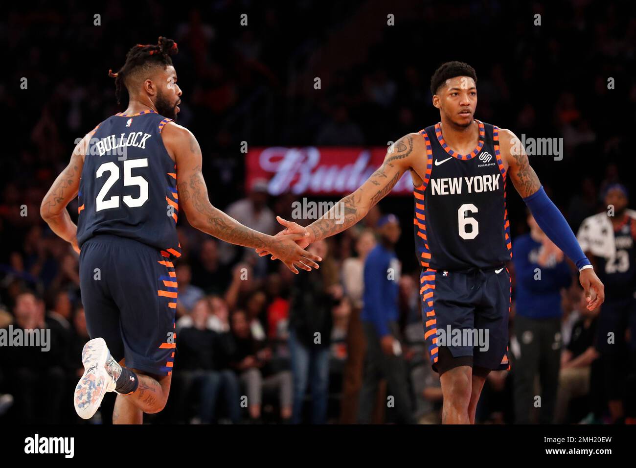 New York Knicks guard Reggie Bullock (25) celebrates with guard Elfrid ...