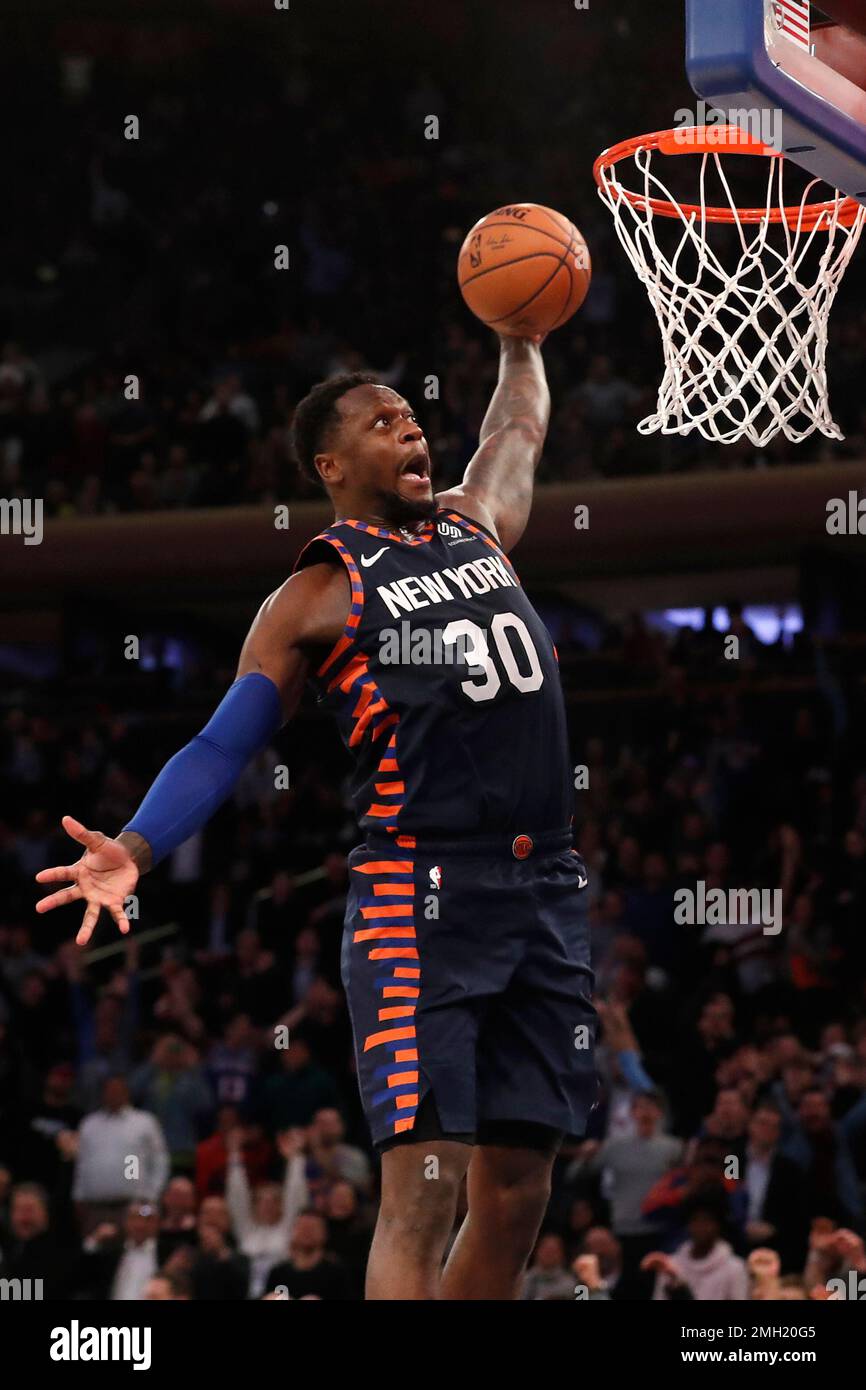New York Knicks forward Julius Randle makes a slam dunk after the ...