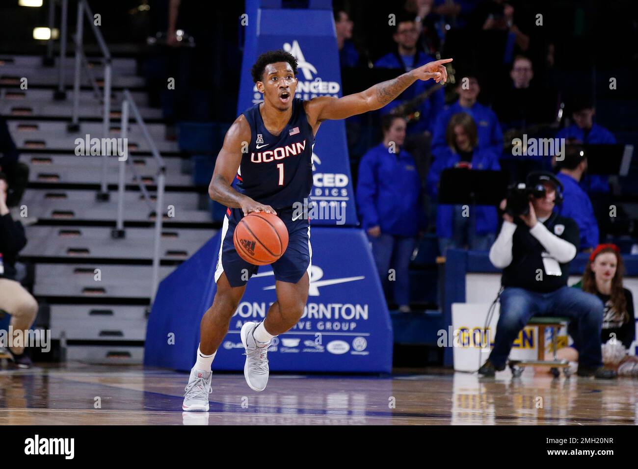 Connecticut guard Christian Vital (1) brings the ball up the court ...