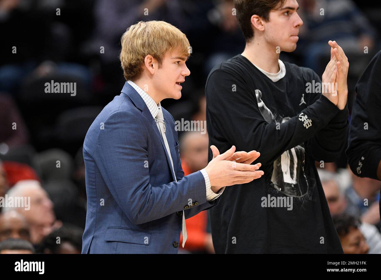 Georgetown guard Mac McClung, center, reacts from the bench during the ...