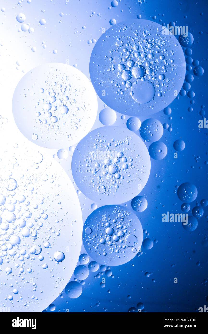 Blue oil bubbles background for cosmetic liquid beauty product. Face ...