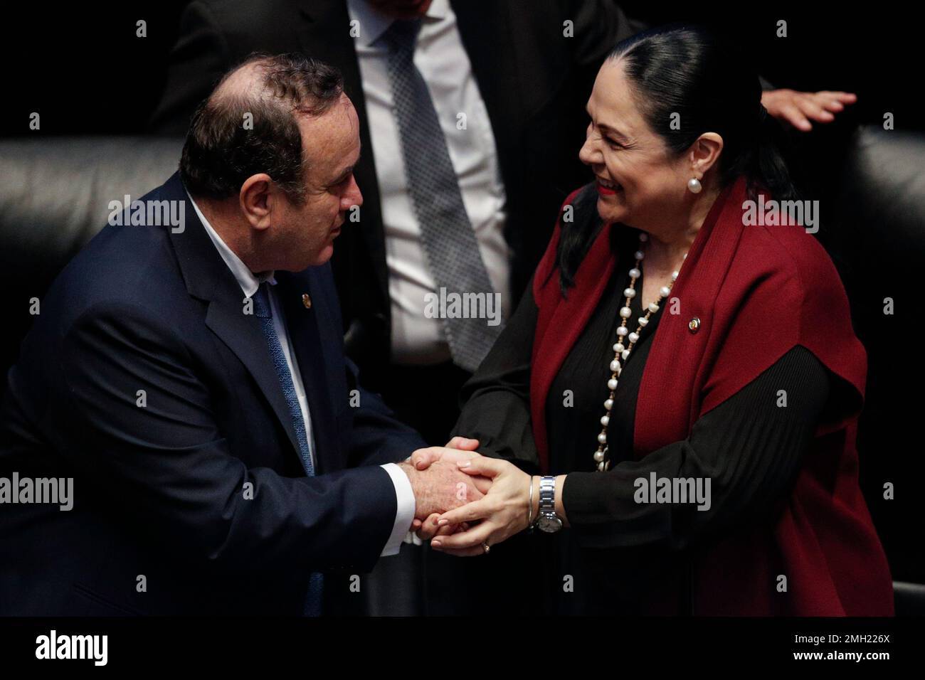 Guatemala's President Alejandro Giammattei shakes hands with Mexican ...