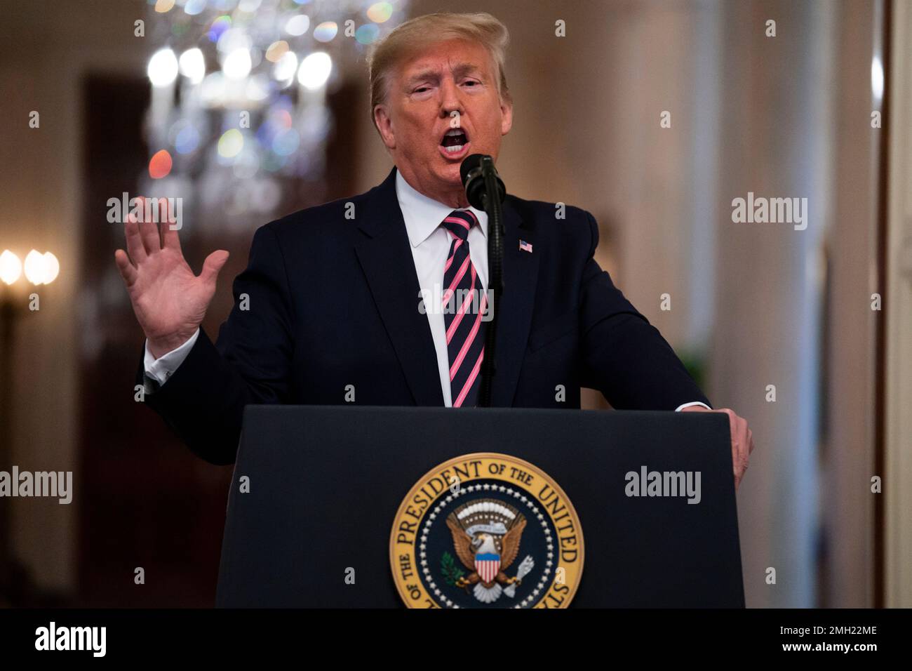 President Donald Trump speaks in the East Room of the White House ...