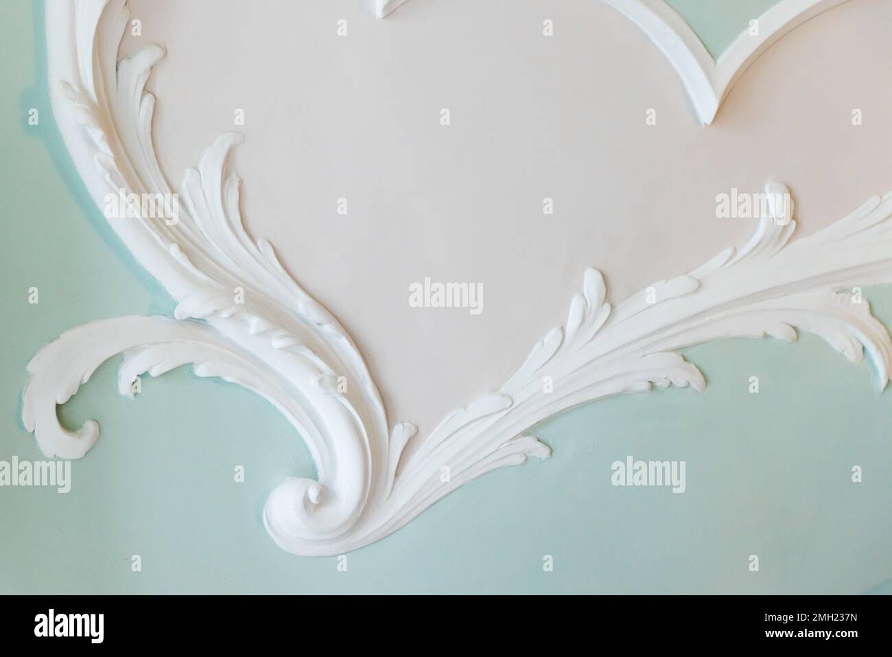 White gypsum bas-relief ceiling design details in rococo style, classic ...