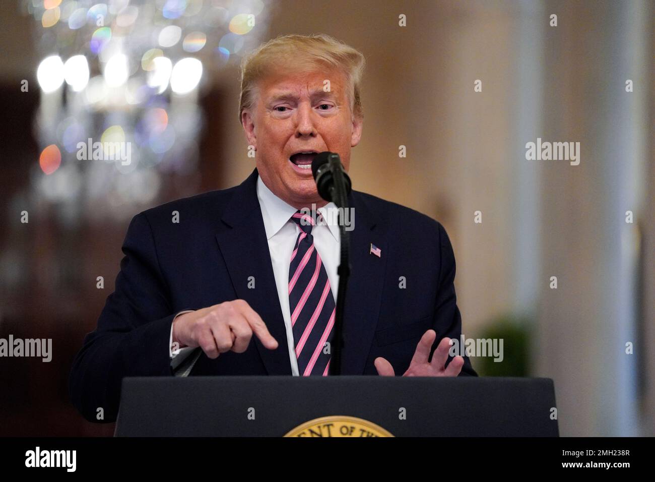 President Donald Trump speaks in the East Room of the White House ...