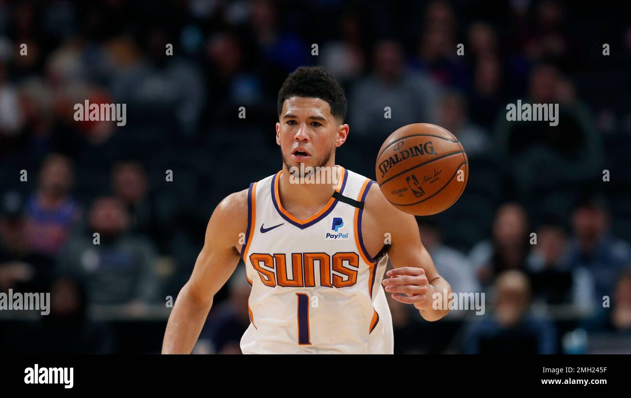 Phoenix Suns guard Devin Booker brings the ball up court during the ...