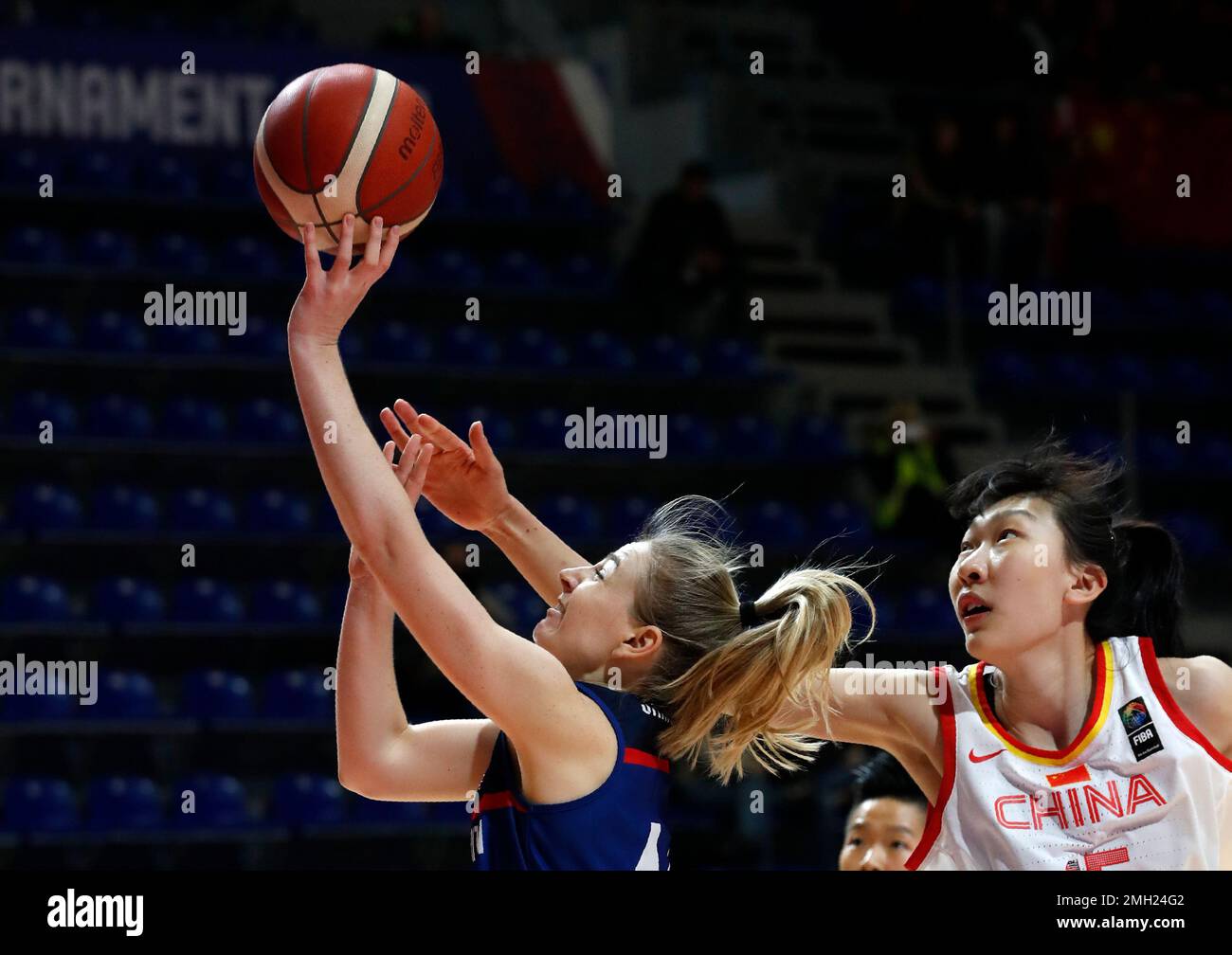 Great Britain's Karlie Samuelson, left, jumps to shoot as China's Xu ...