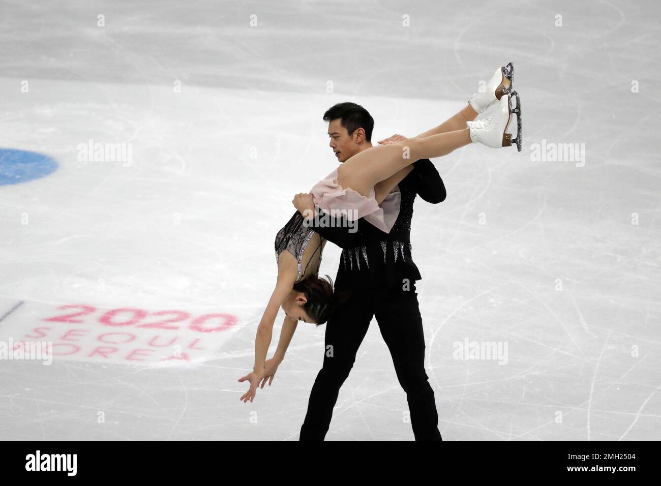 China's Peng Cheng and Jin Yang perform during the pair short program ...