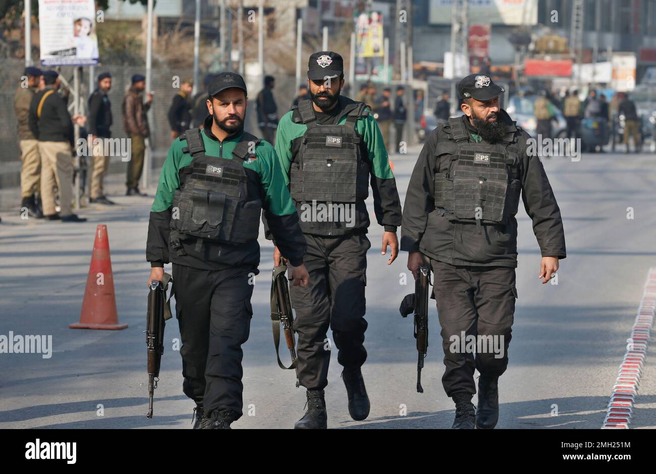 Police commandos patrol the vicinity of Pindi Cricket Stadium, where ...