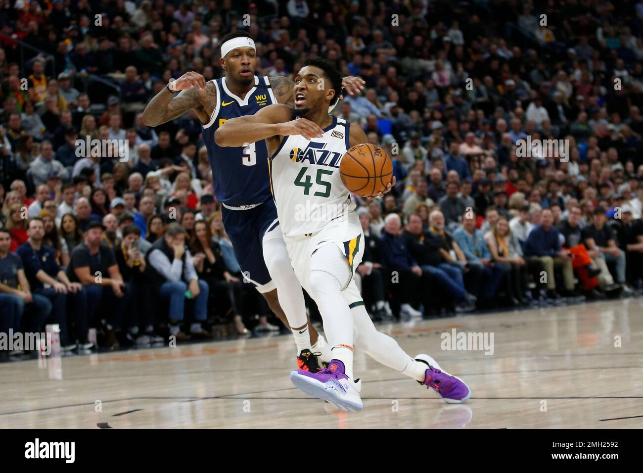 Utah Jazz guard Donovan Mitchell (45) drives around Denver Nuggets ...