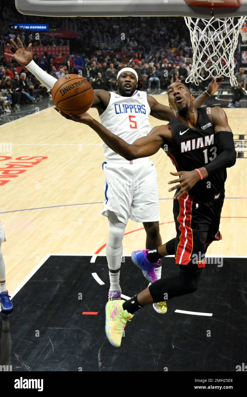 Miami Heat forward Bam Adebayo, right, shoots as Los Angeles Clippers ...